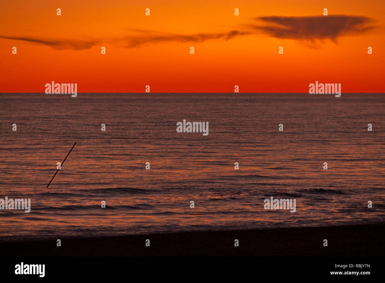 winter seaside landscape with sunset Stock Photo - Alamy