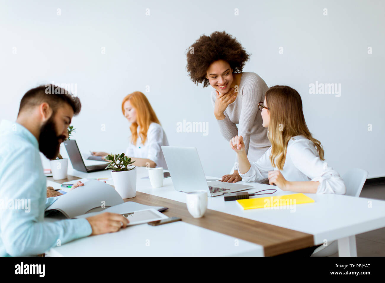 Successful business people discussing documents and working in modern ...