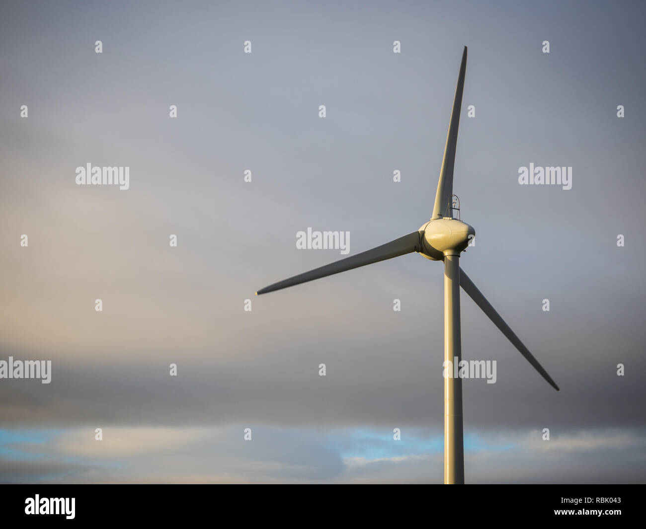 Alternative energy source. Close up of a single windmill turbine near ...