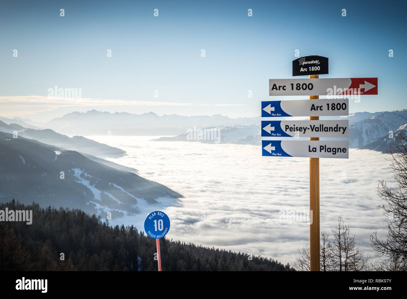 Slope signs for Les Arcs ski resort, with a background of mountains ...