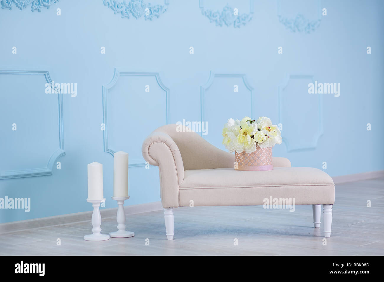 Interior mock up photo. Blue wall with leather material divan sofa and ...