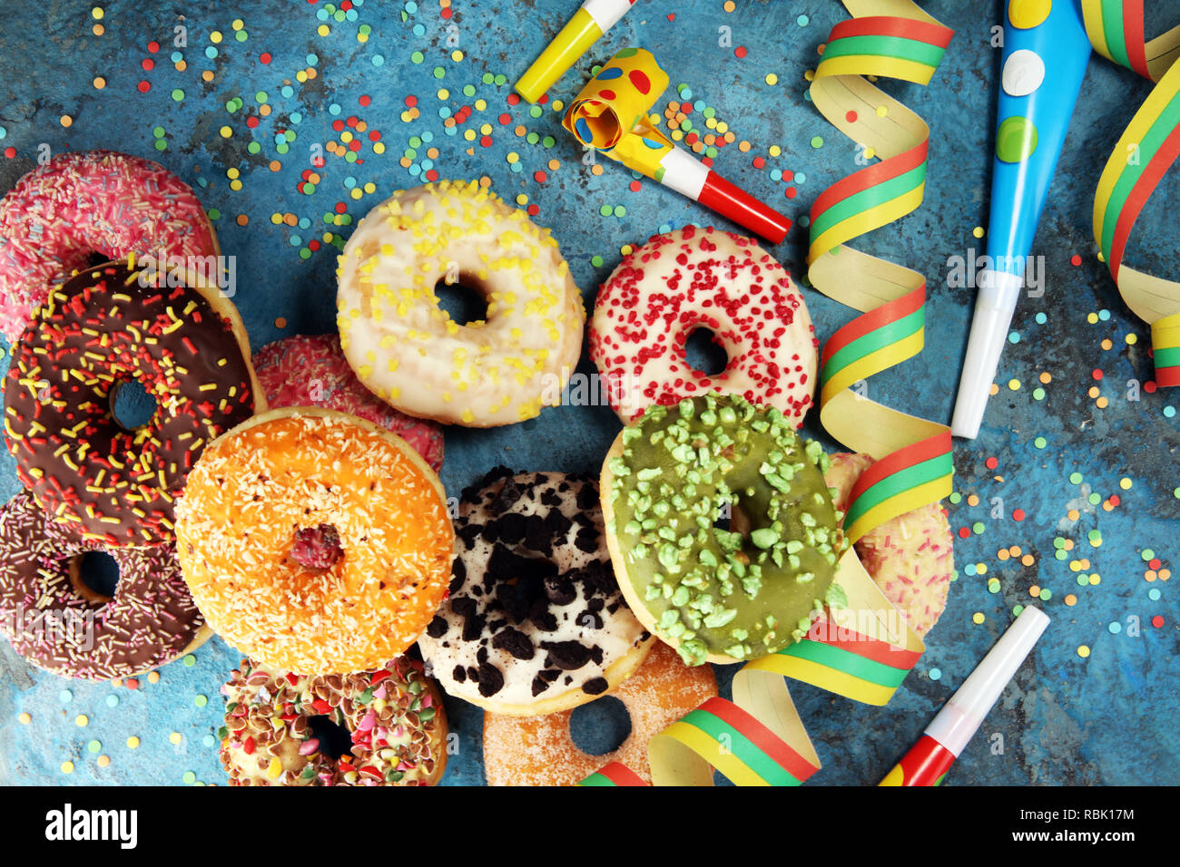assorted donuts with chocolate frosted, pink glazed and sprinkles ...