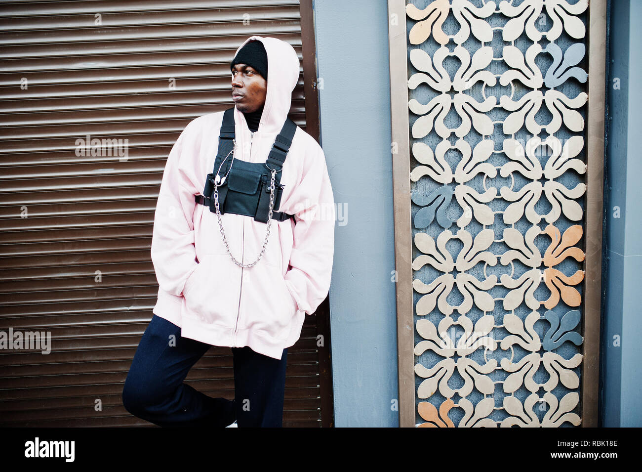 Stylish urban style african american man in pink hoodie posed. Afro ...