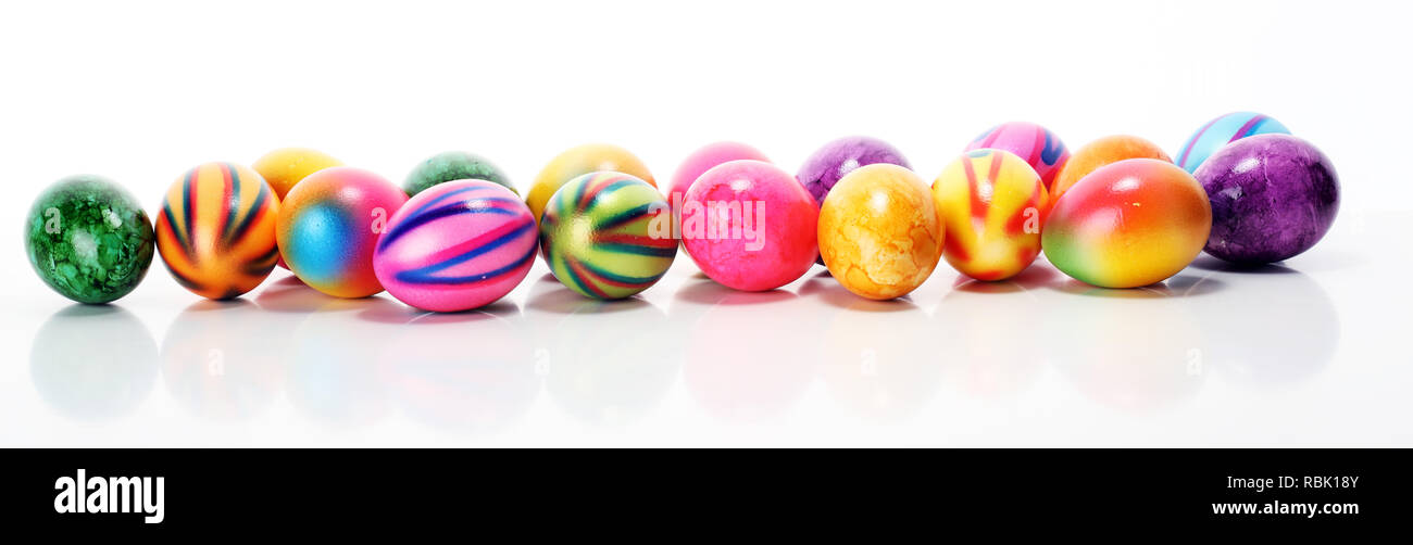 Row of Easter eggs on table. colorful easter decoration Stock Photo - Alamy
