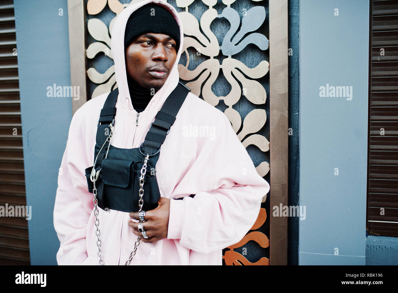 Stylish urban style african american man in pink hoodie posed. Afro ...