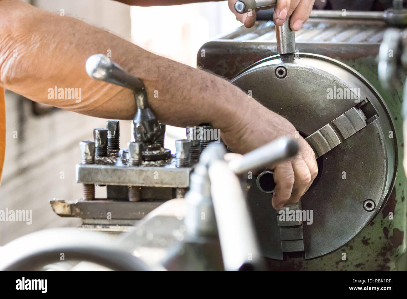 A male worker operating a lathe inside an aluminium factory Stock Photo ...