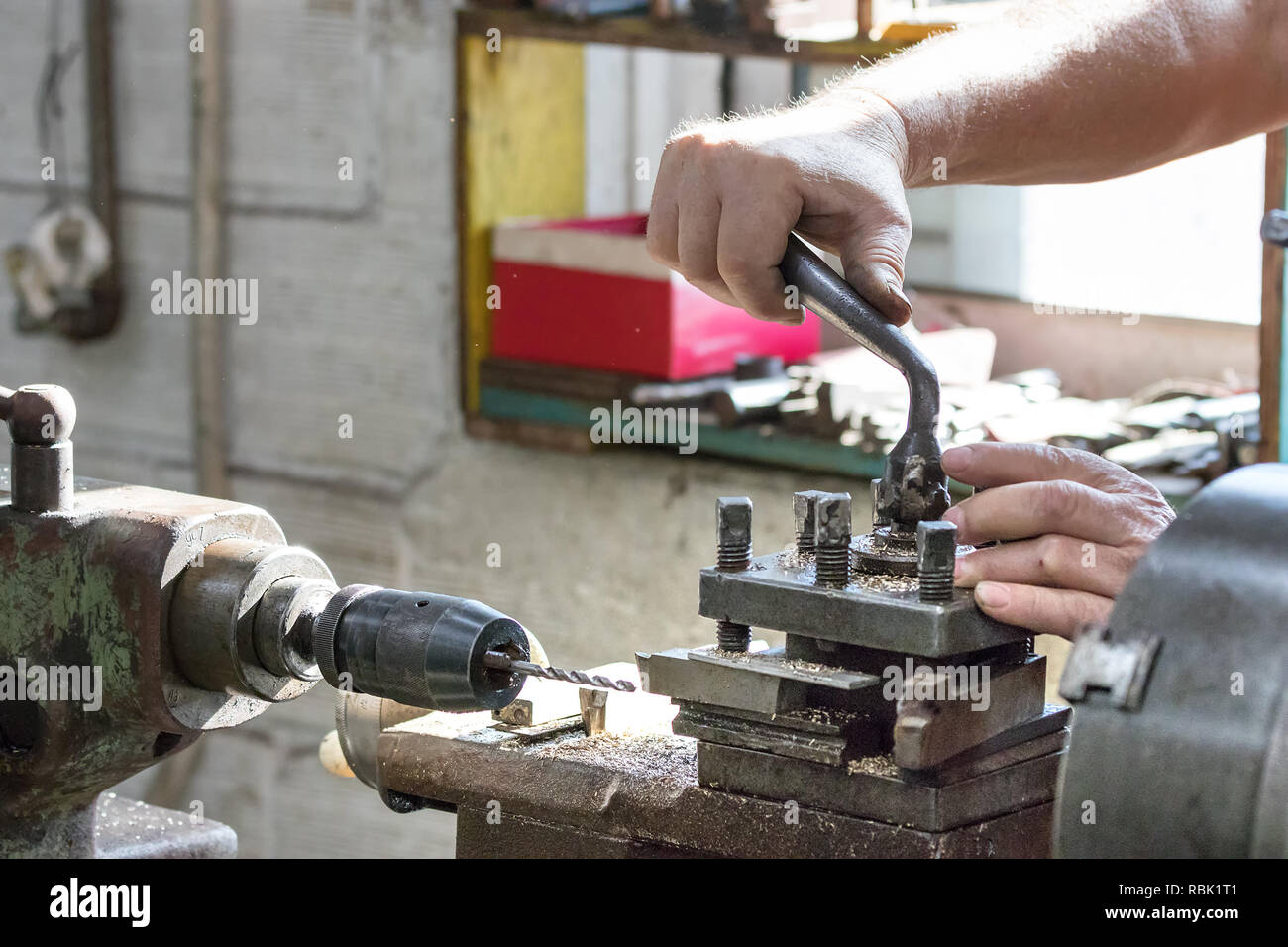 A male worker operating a lathe inside an aluminium factory Stock Photo ...