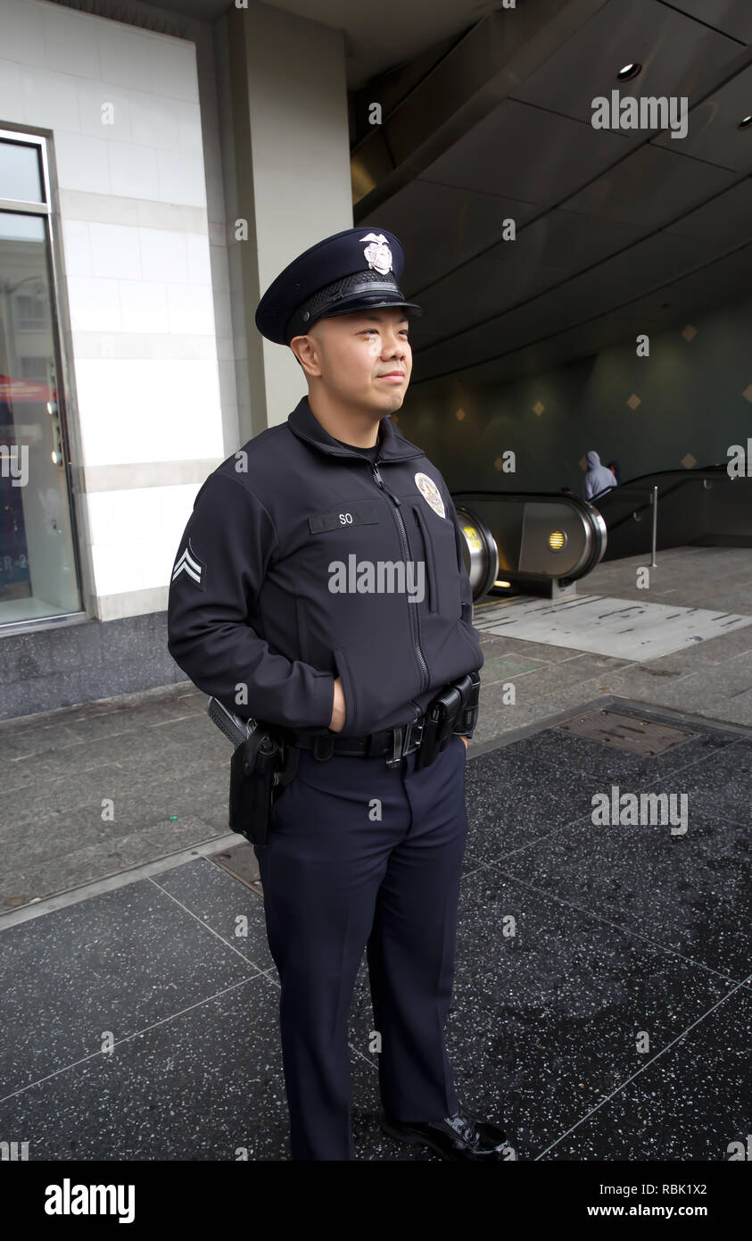 Police Officer standing while on duty on Hollywood Boulevard,California ...