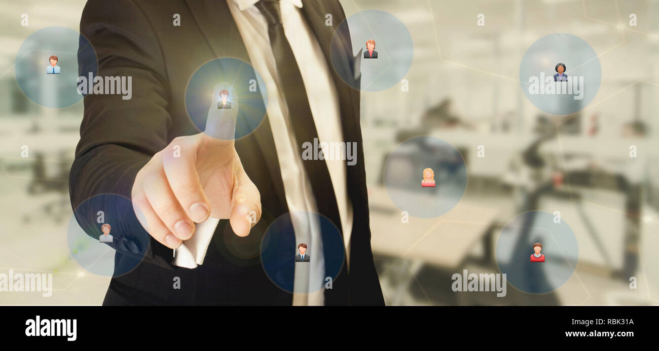 Businessman touches his staff with his finger Stock Photo - Alamy