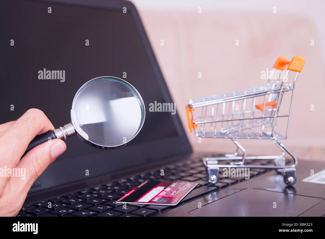 customer looks at computer screen with magnifier Stock Photo - Alamy