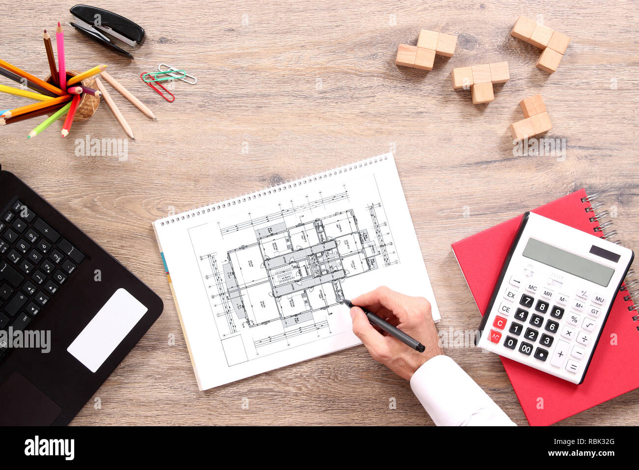 architect is drawing the construction project Stock Photo - Alamy