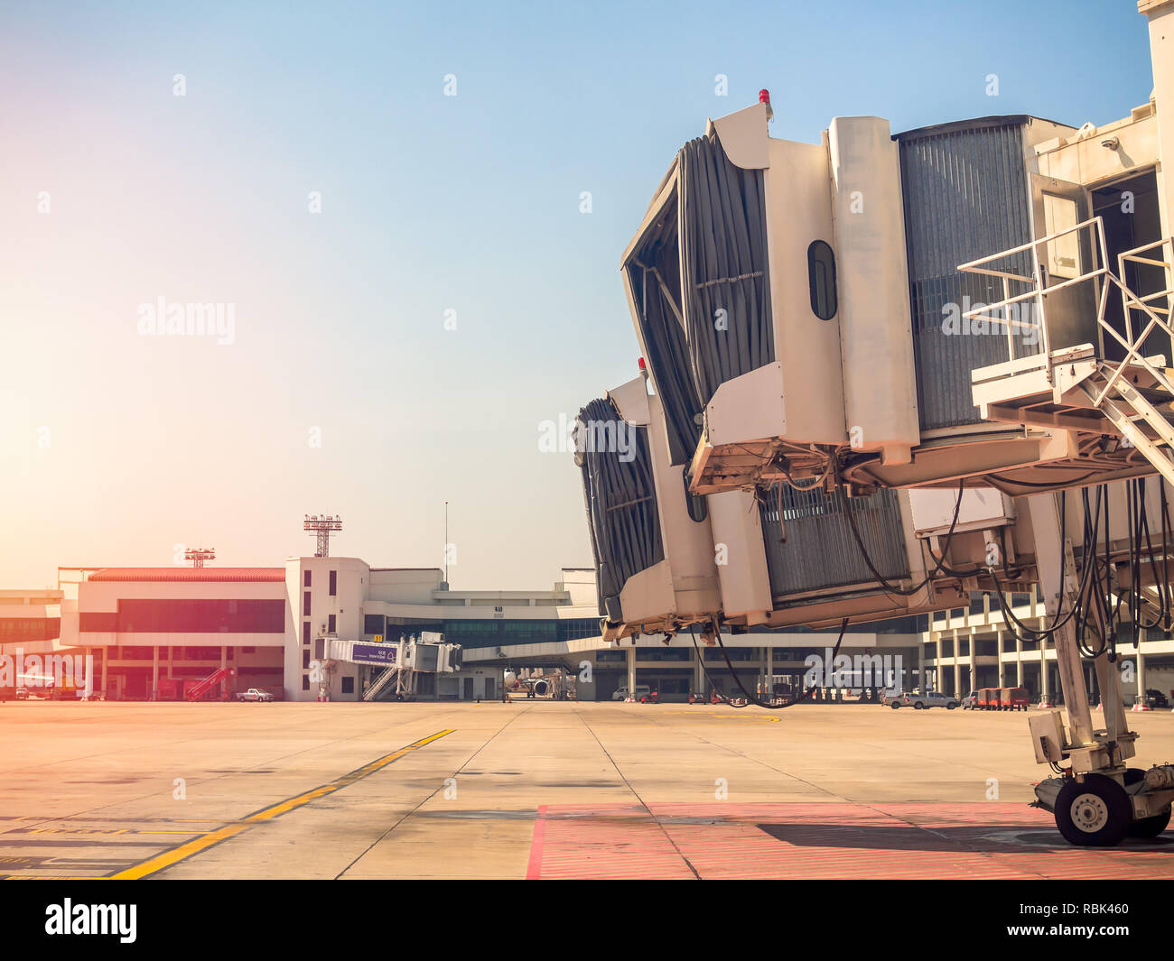 Airplane at the passenger boarding bridge on the runway hi-res stock ...
