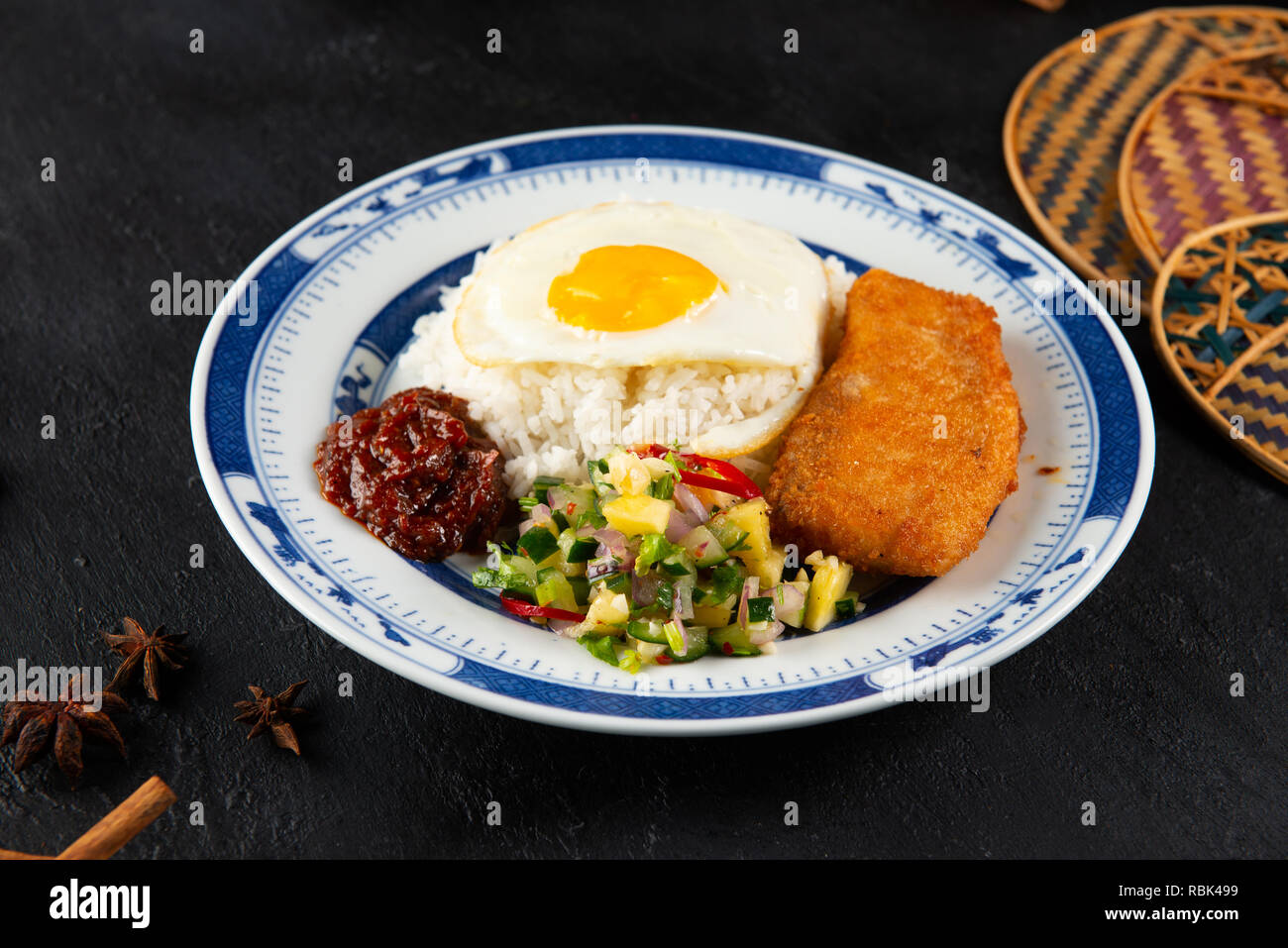 asian style fried fish fillet rice with sambal and salsa acar Stock ...