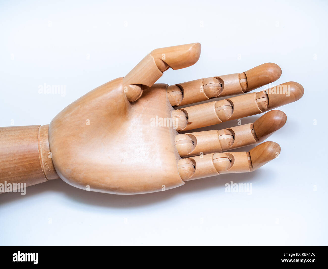 Wooden left hand isolated on white background Stock Photo - Alamy