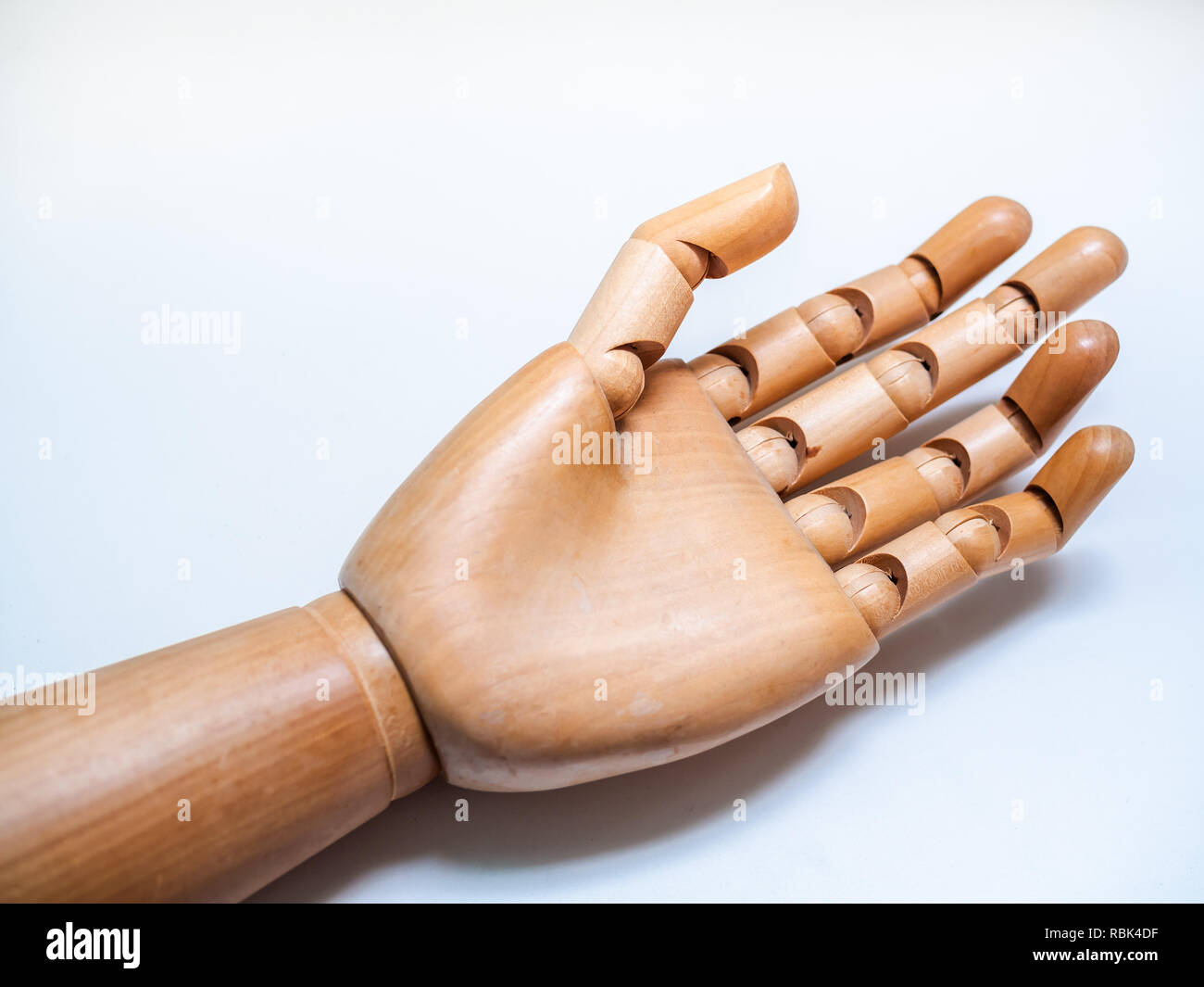 Wooden left hand isolated on white background Stock Photo - Alamy