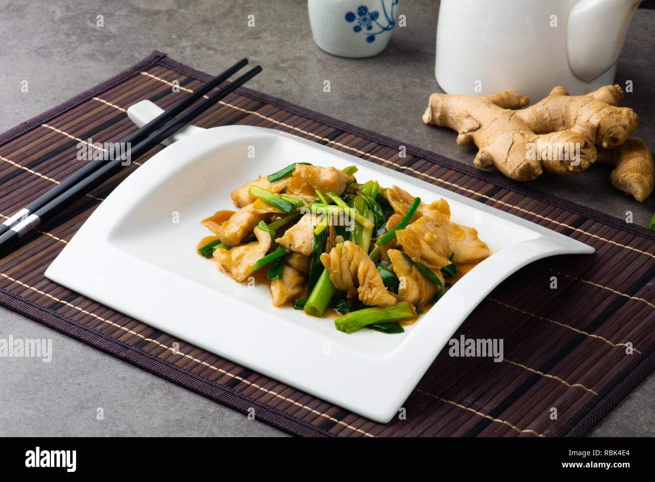 chinese stir fry ginger spring onion chicken Stock Photo - Alamy