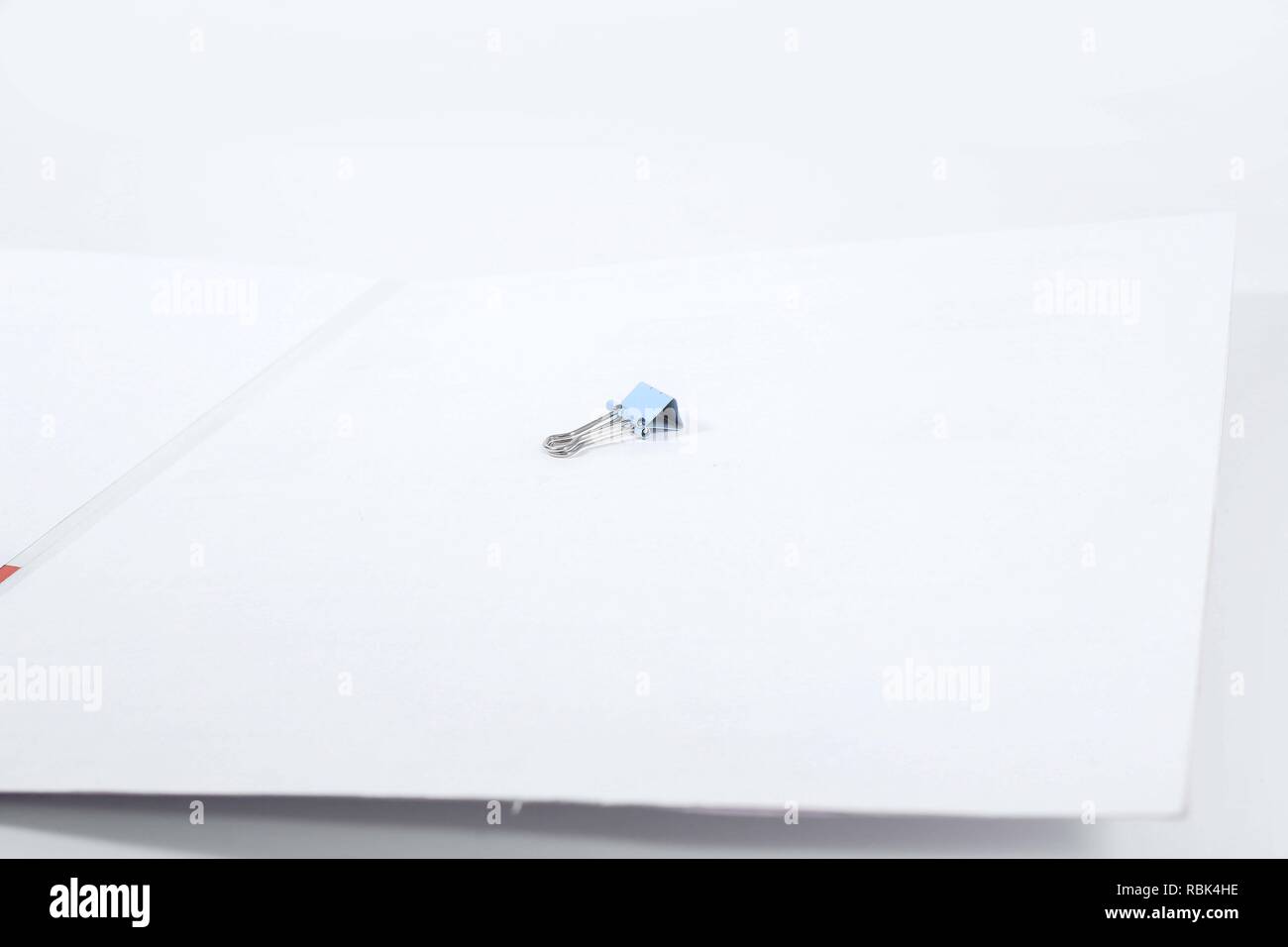 Picture of paper clip on the magazine cover. Isolated on the white ...