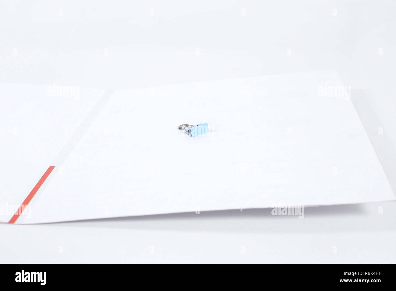 Picture of paper clip on the magazine cover. Isolated on the white ...