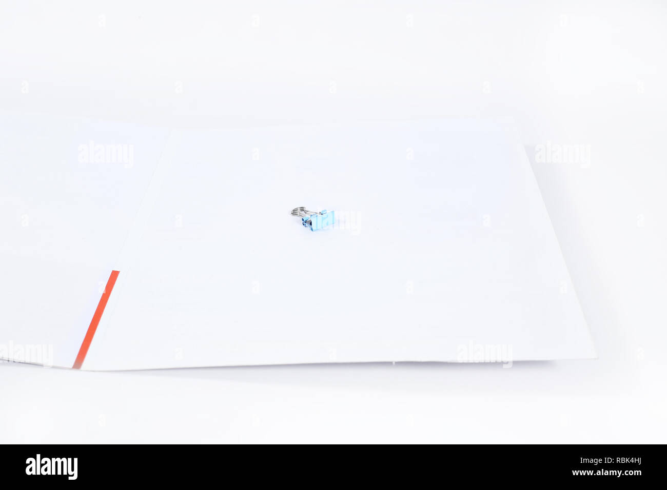 Portrait of paper clip on the magazine cover. Isolated on the white ...