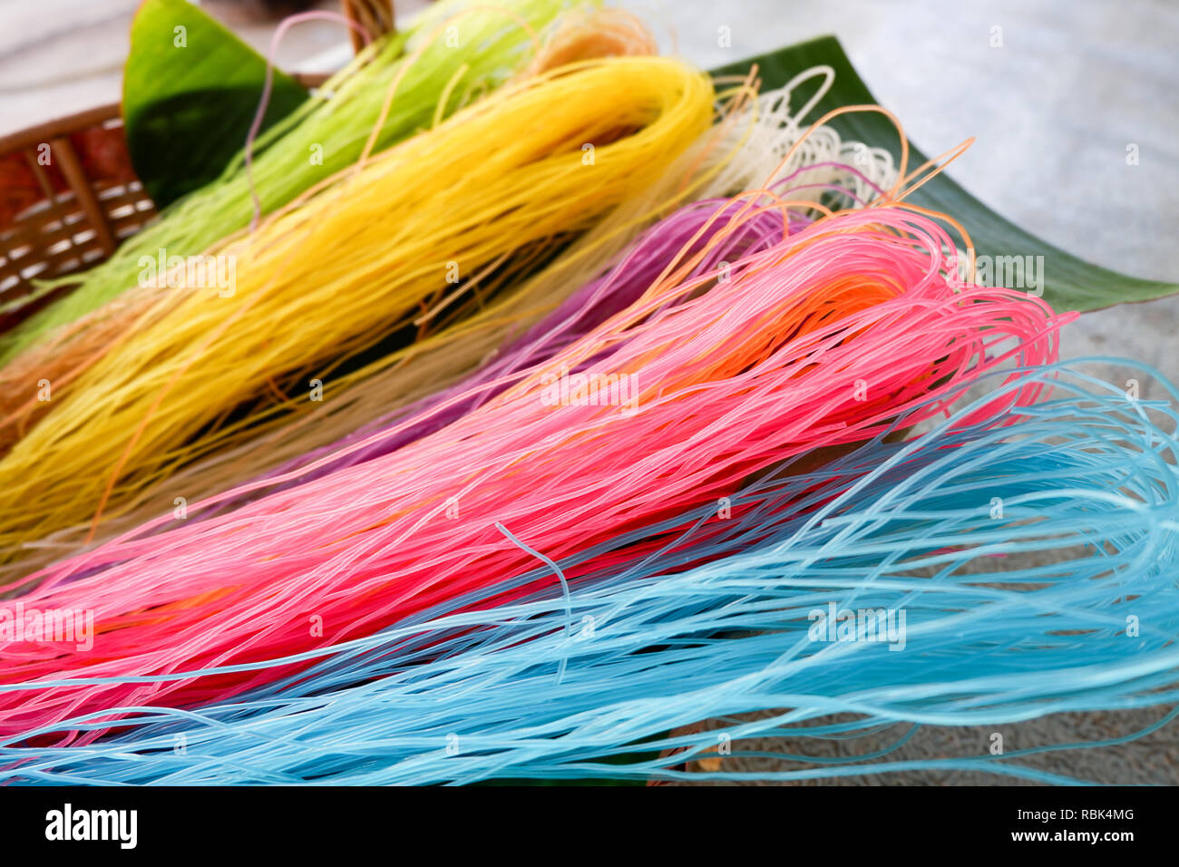 Noodle rice vermicelli / dried rice noodles colorful on banana leaf in ...