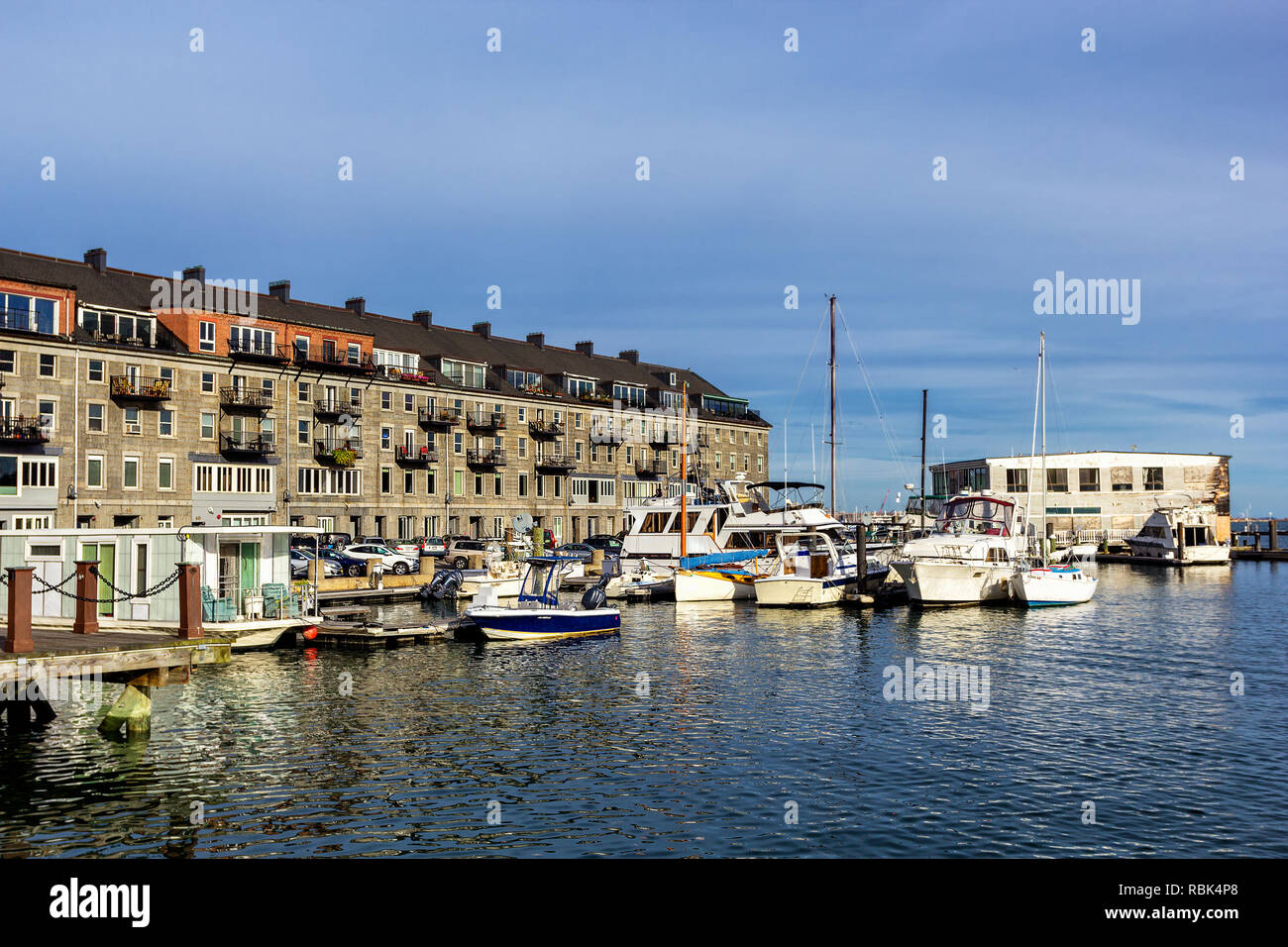 Beautiful grey house and pier with boats and yachts in North End ...