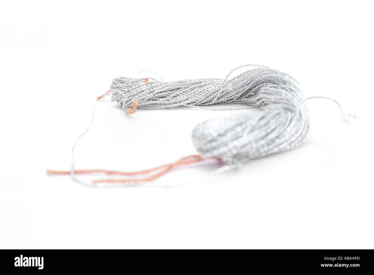 Portrait of thread on the white background Stock Photo - Alamy