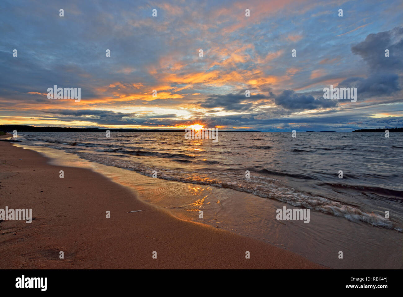 Lake Superior shoreline at sunset, Munising, Michigan, USA Stock Photo ...