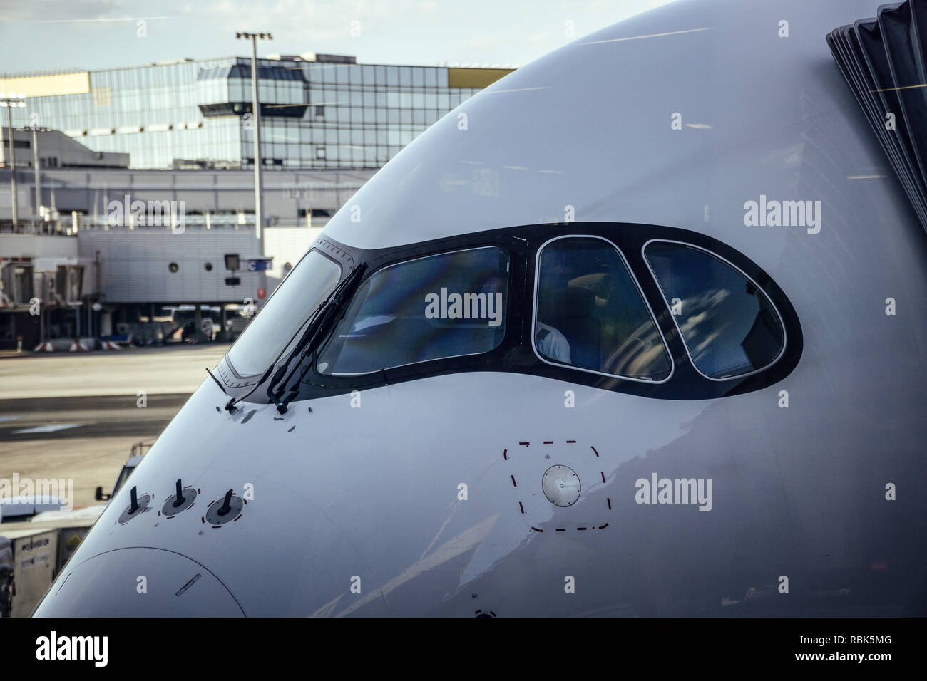 Outside view of an airplane cockpit at the airport Stock Photo - Alamy