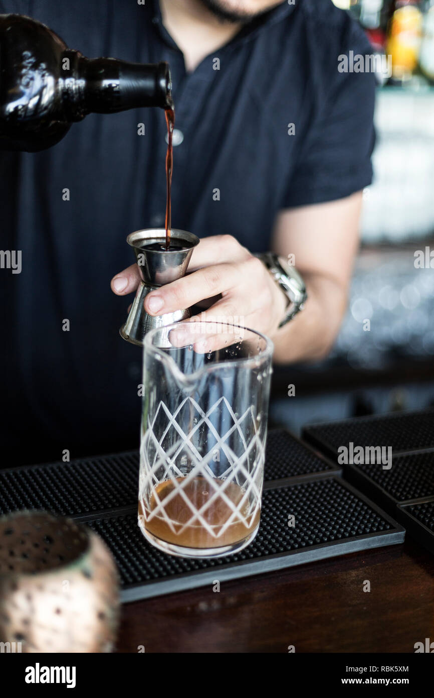 Bartender making cocktails in a restaurant Stock Photo - Alamy