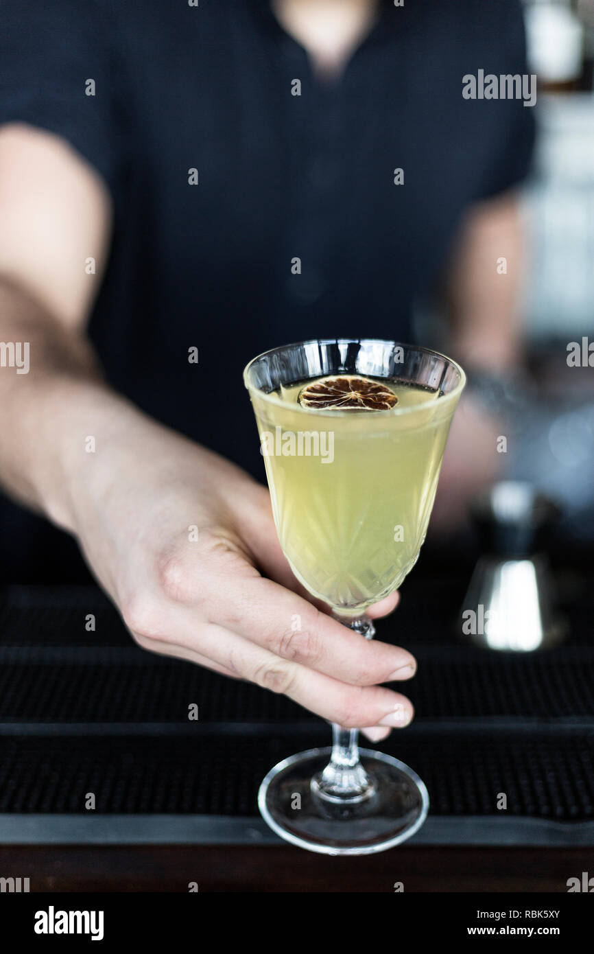 Bartender making cocktails in a restaurant Stock Photo - Alamy