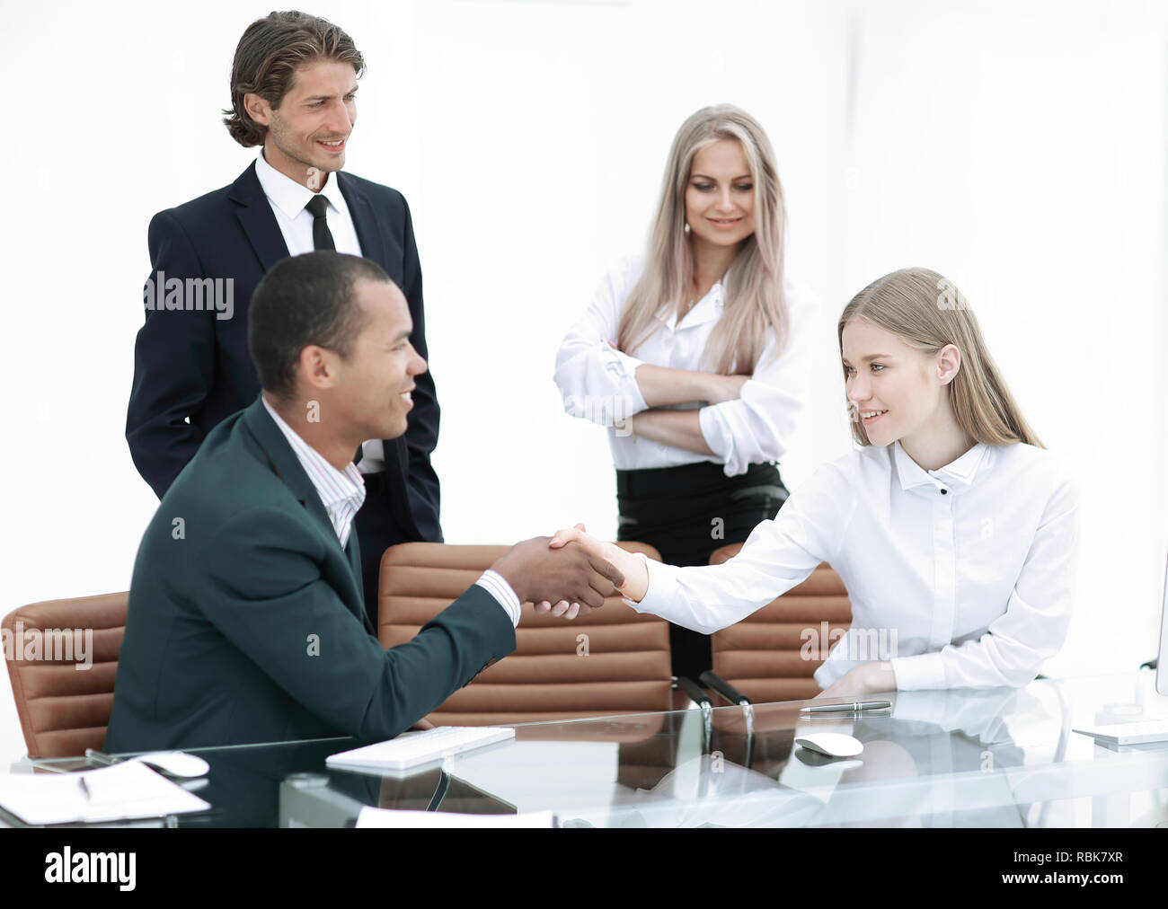 handshake Manager and the client in the office Stock Photo - Alamy