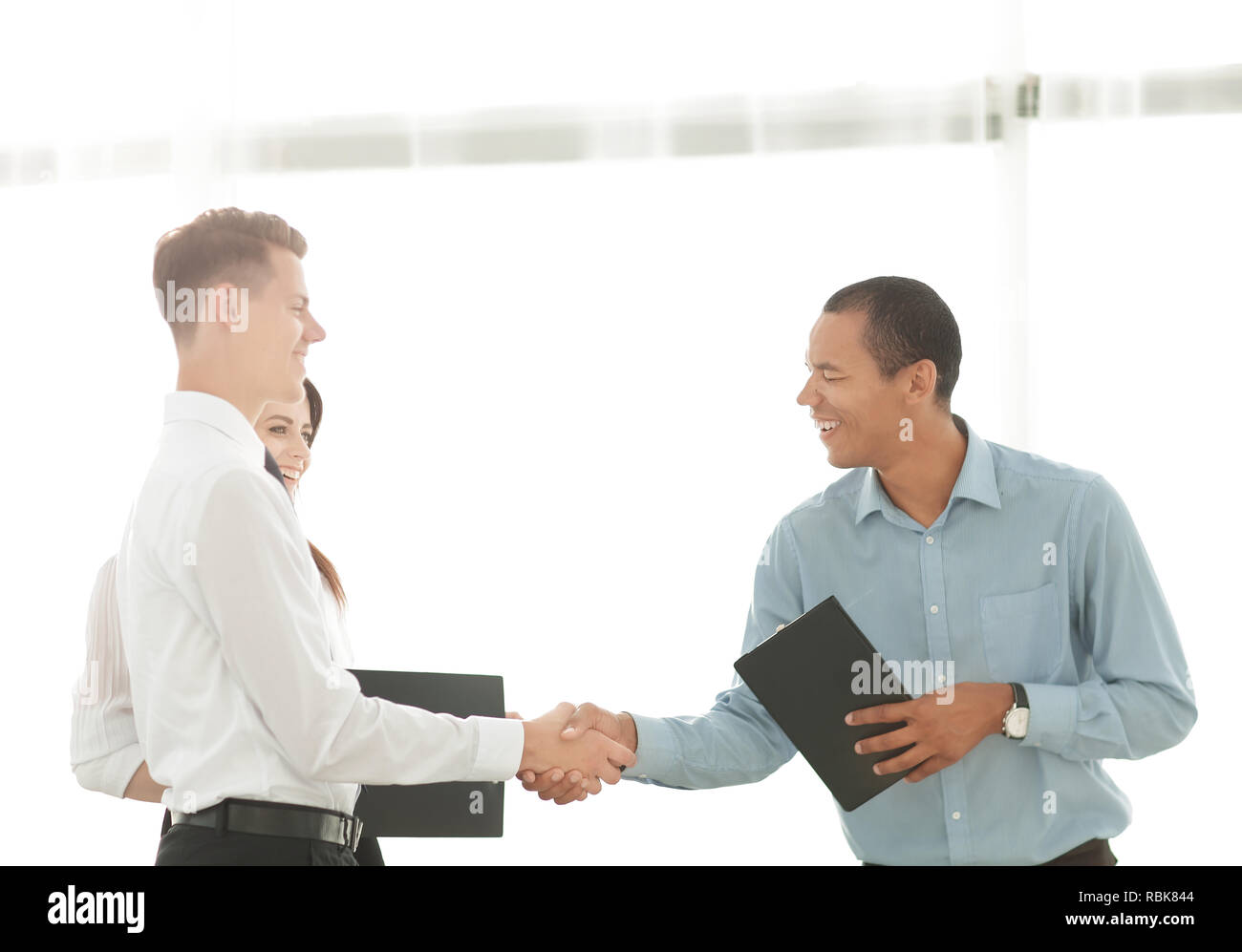 handshake of business people standing in office Stock Photo - Alamy