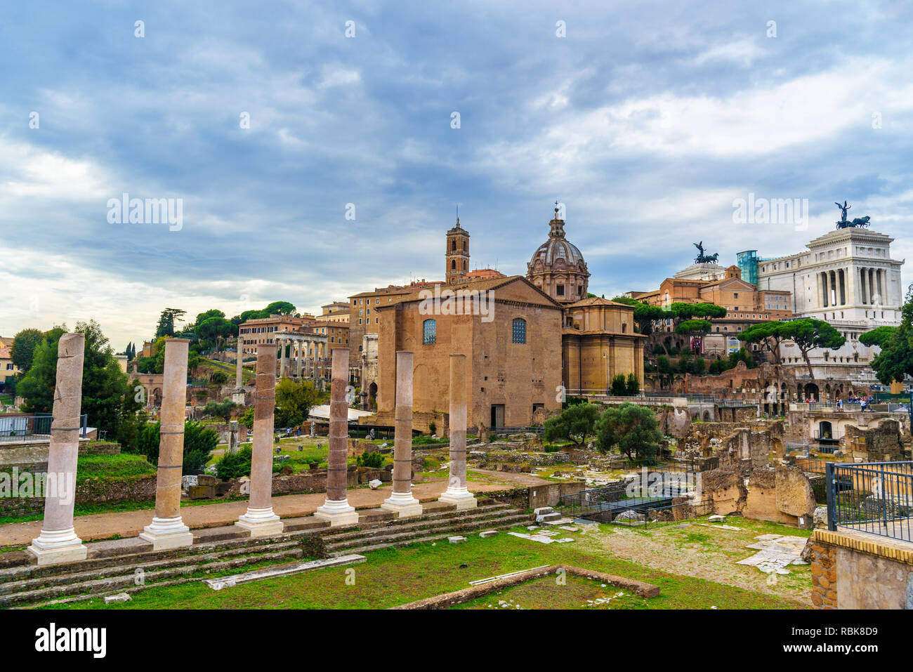 Ruins of Roman Forum. Curia Julia, Roman columns and church of Santi ...