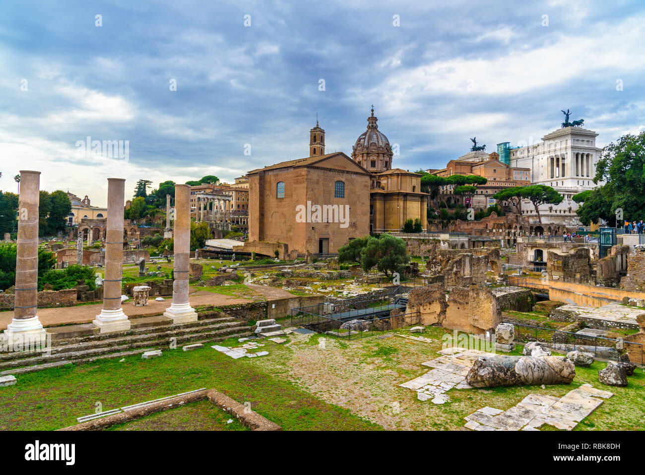 Ruins of Roman Forum. Curia Julia, Roman columns and church of Santi ...