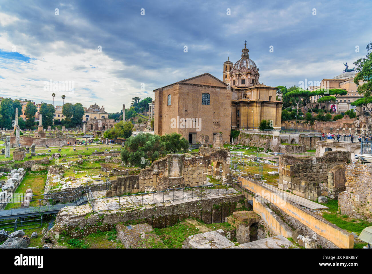 Ruins of Roman Forum. Curia Julia, Roman columns and church of Santi ...