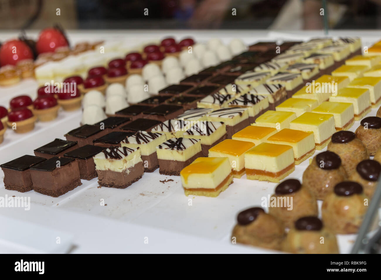 Colourful Pastries and Biscuits inside a Display Case in a Pastry Shop ...
