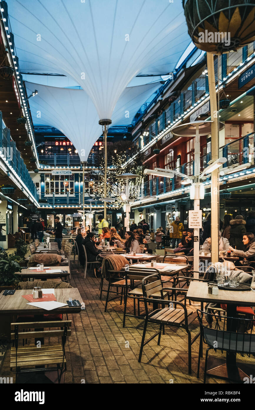 London, UK - January 5, 2019: People sitting at the outdoor tables of ...