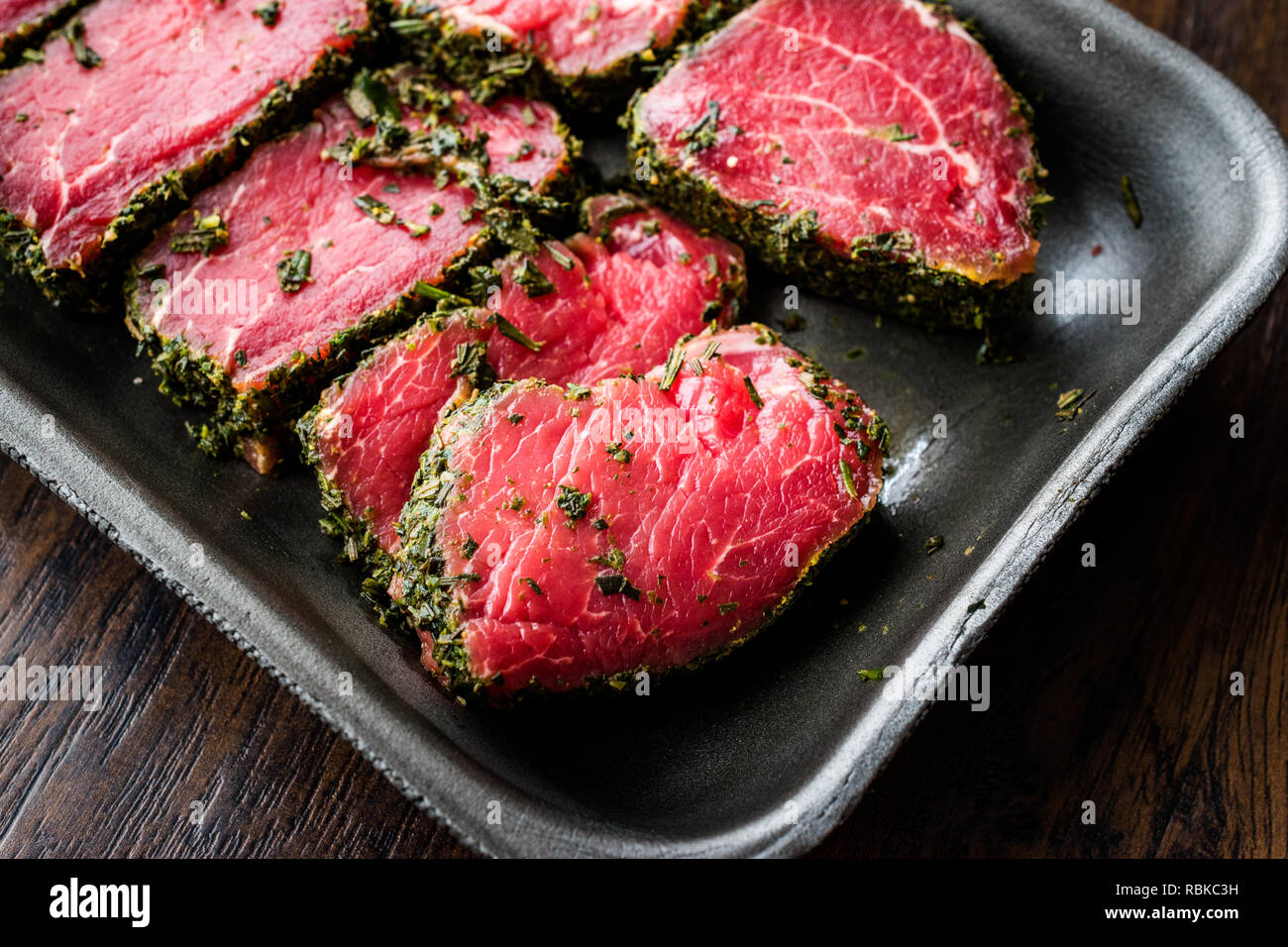Package of Raw Tenderloin Meat with Herbs and Spices in Plastic Box ...