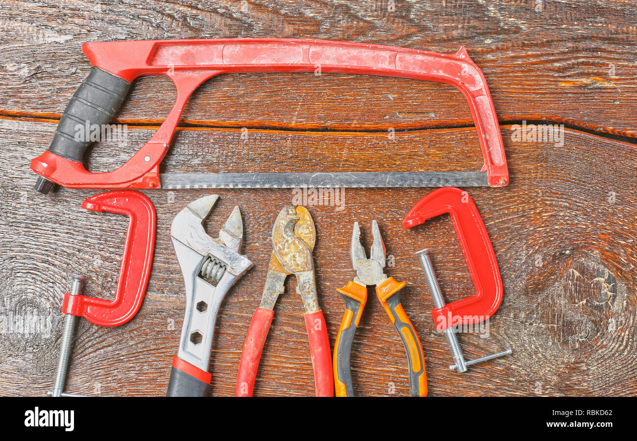 Workshop bench. Variety of hand tools on a wooden table, top view Stock ...