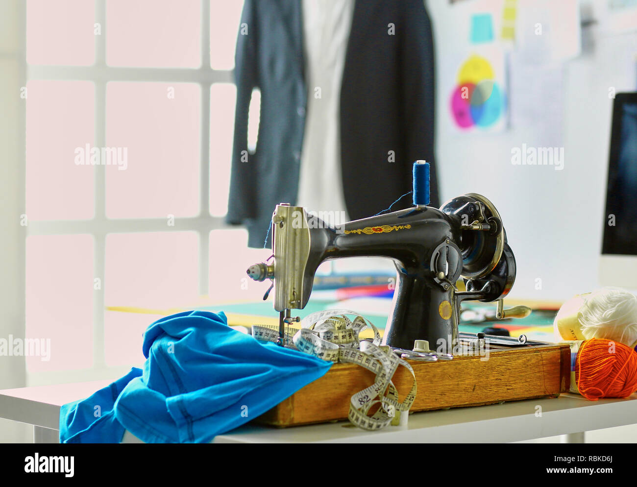 Empty workroom and workplace of tailor or vendor of clothes in small ...