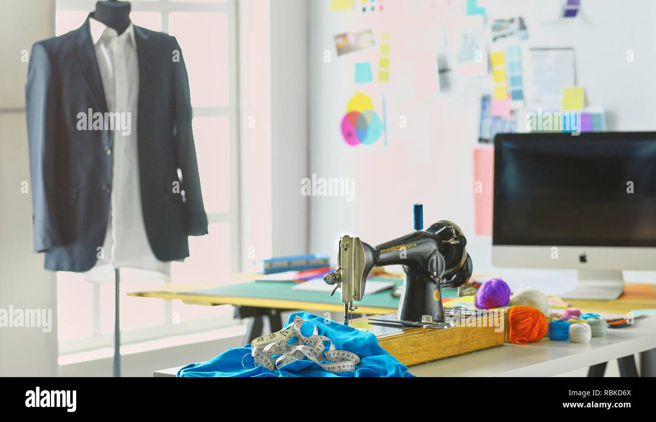 Empty workroom and workplace of tailor or vendor of clothes in small ...