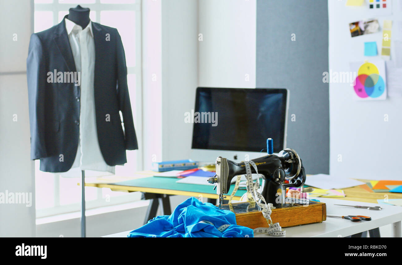 Empty workroom and workplace of tailor or vendor of clothes in small ...