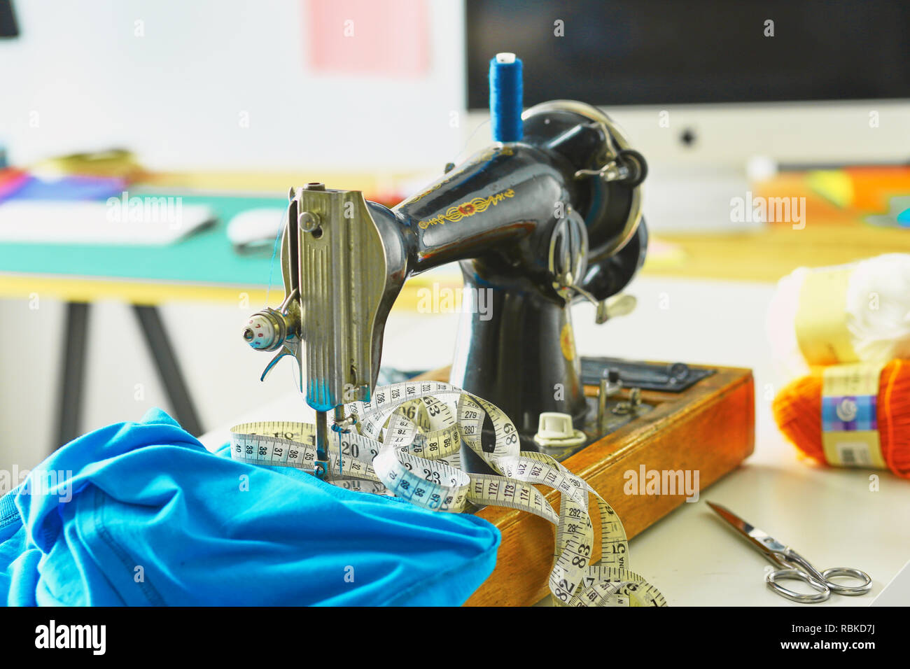 Empty workroom and workplace of tailor or vendor of clothes in small ...