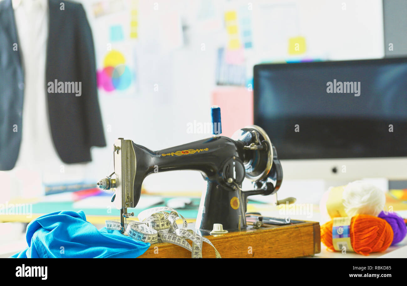Empty workroom and workplace of tailor or vendor of clothes in small ...