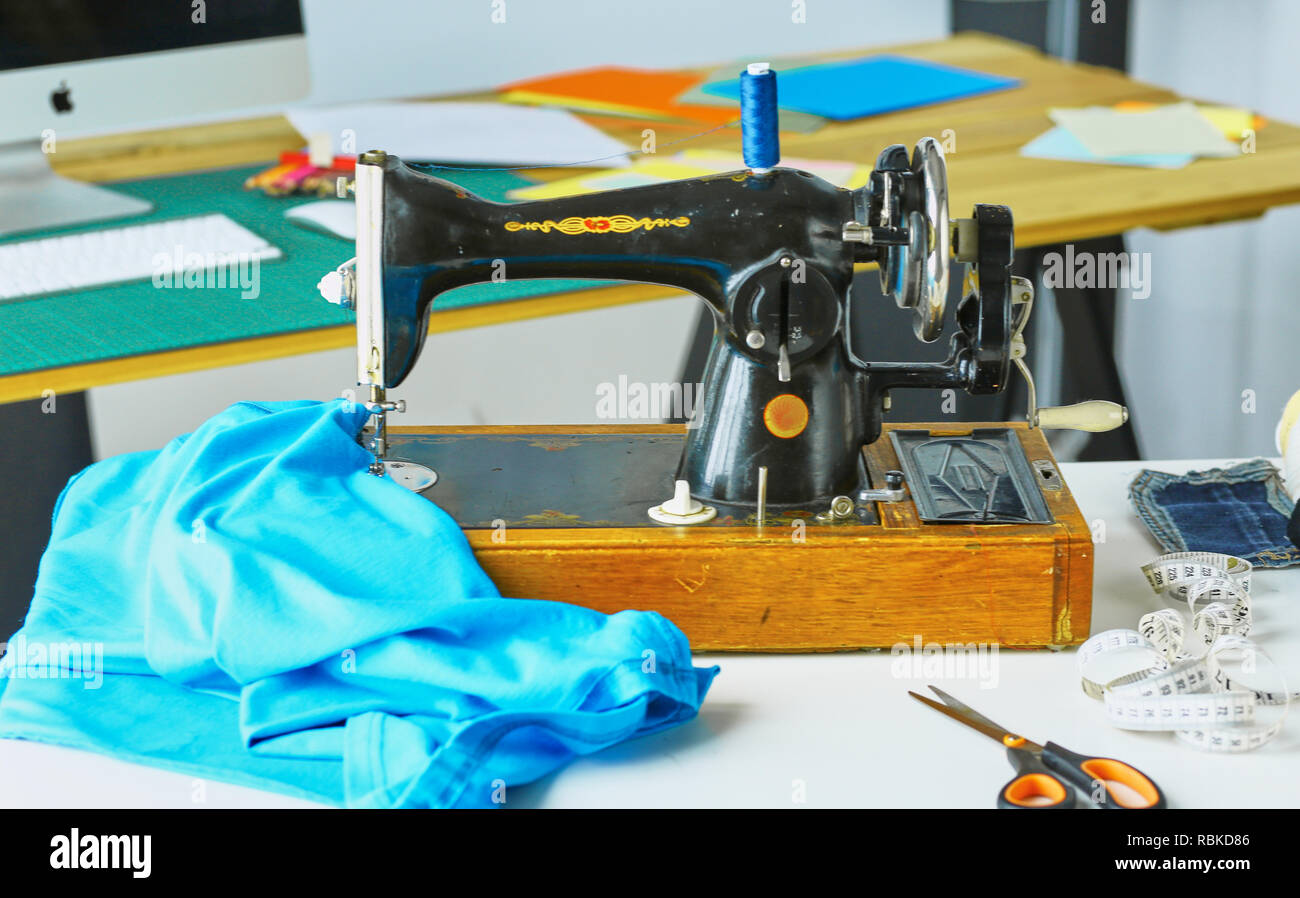 Empty workroom and workplace of tailor or vendor of clothes in small ...