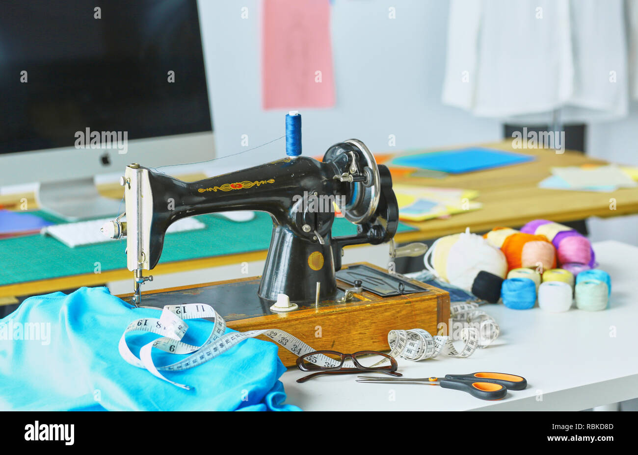 Empty workroom and workplace of tailor or vendor of clothes in small ...