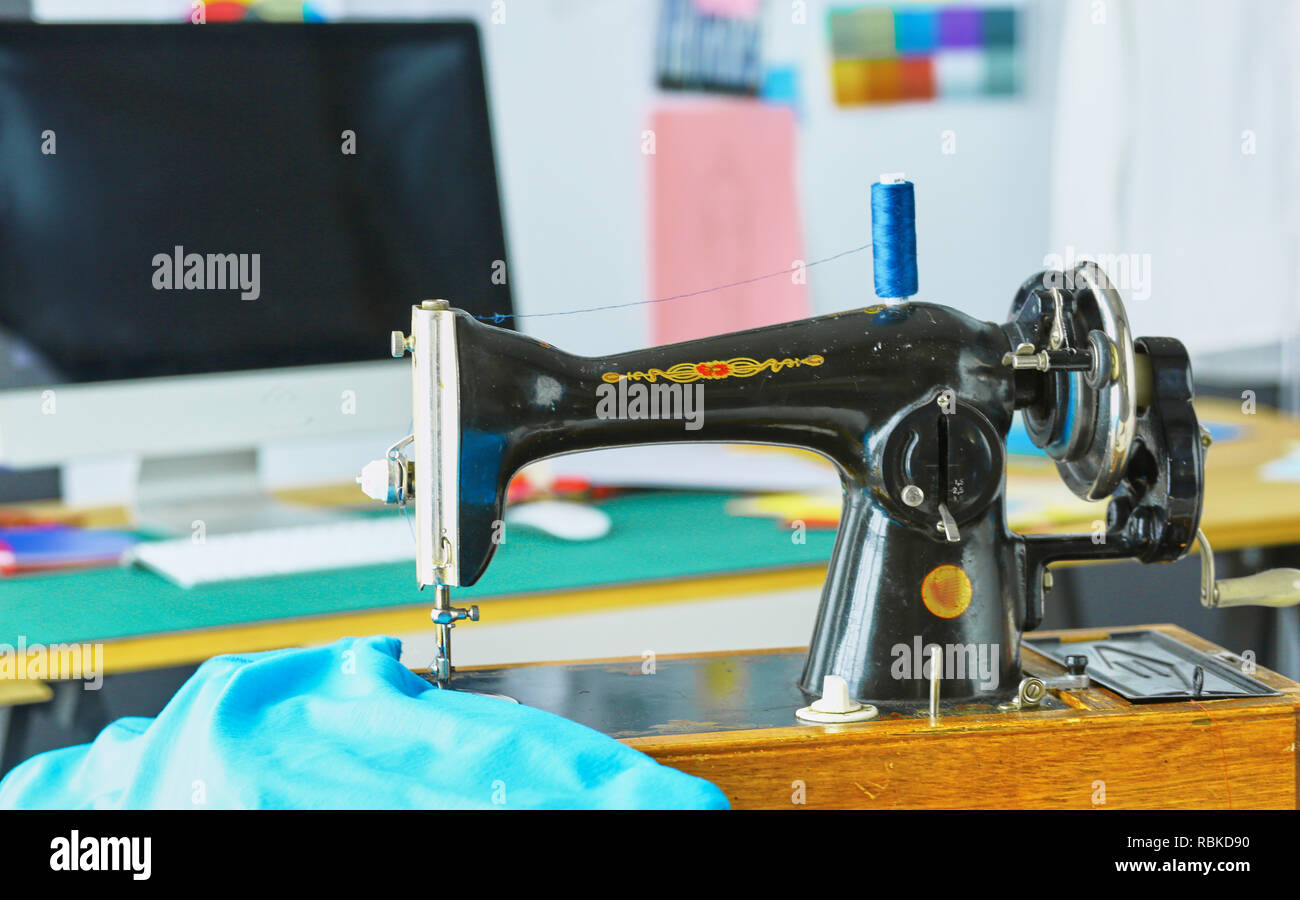 Empty workroom and workplace of tailor or vendor of clothes in small ...