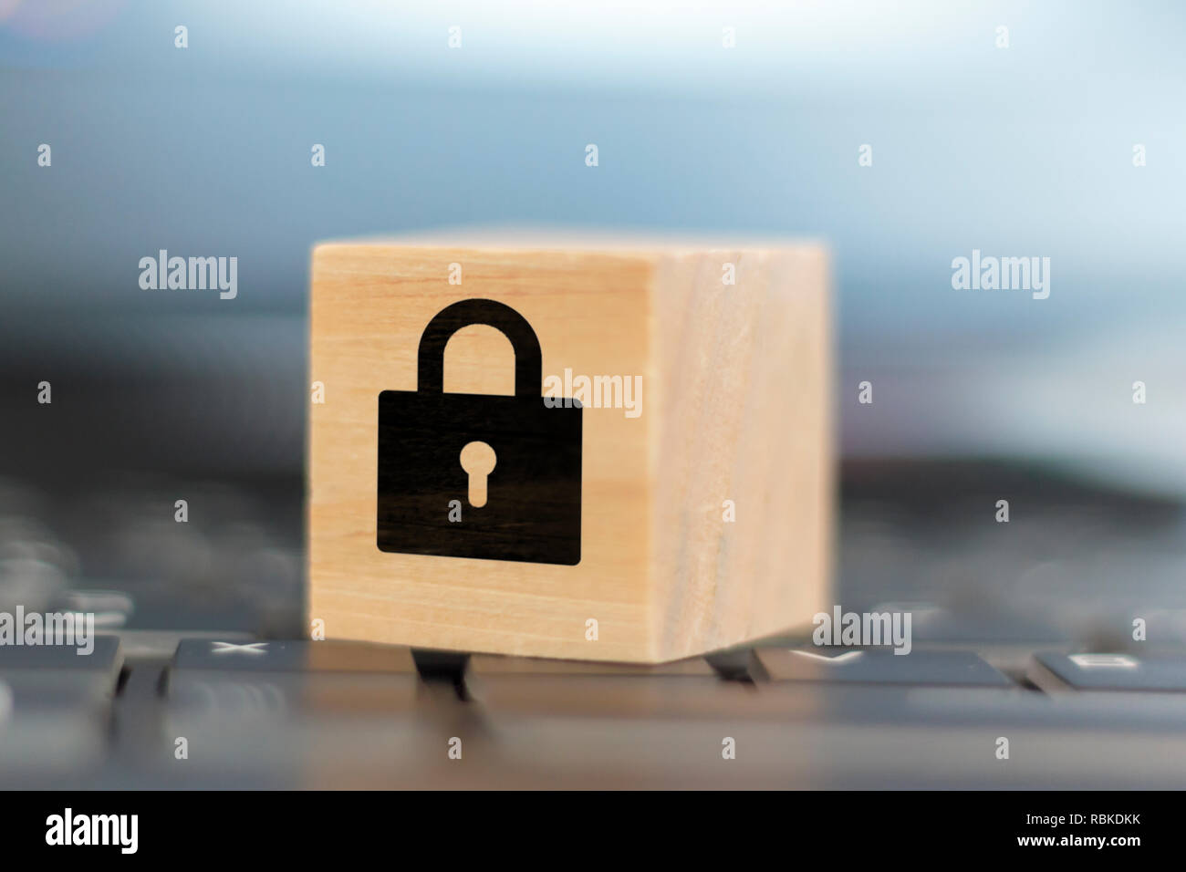Wooden block with lock icon on keyboard. Computer security concept ...