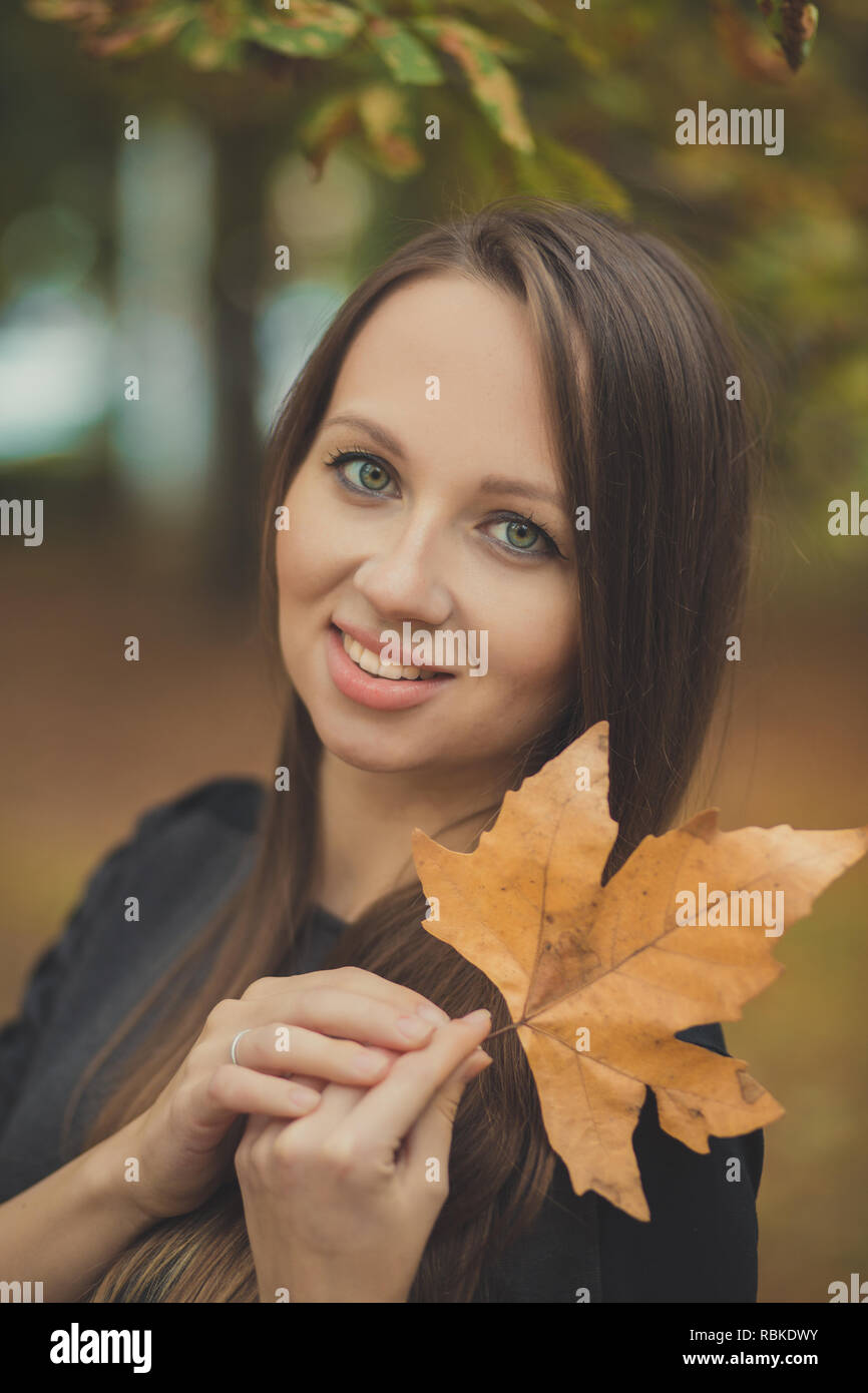 Adorable cute lady woman with brunette hair green eyes pink cheeks rose ...