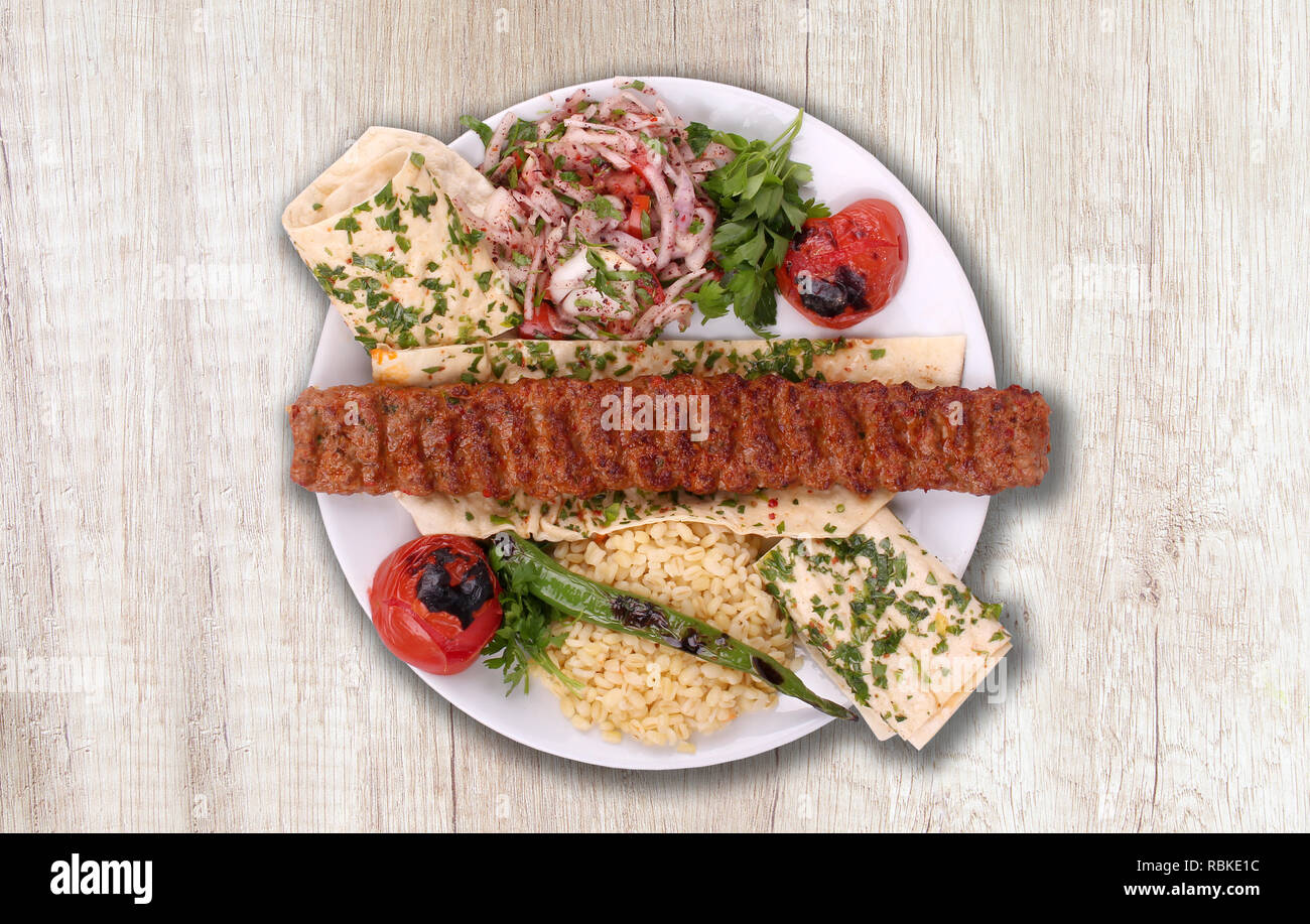 kebab plate on wooden floor S Stock Photo - Alamy